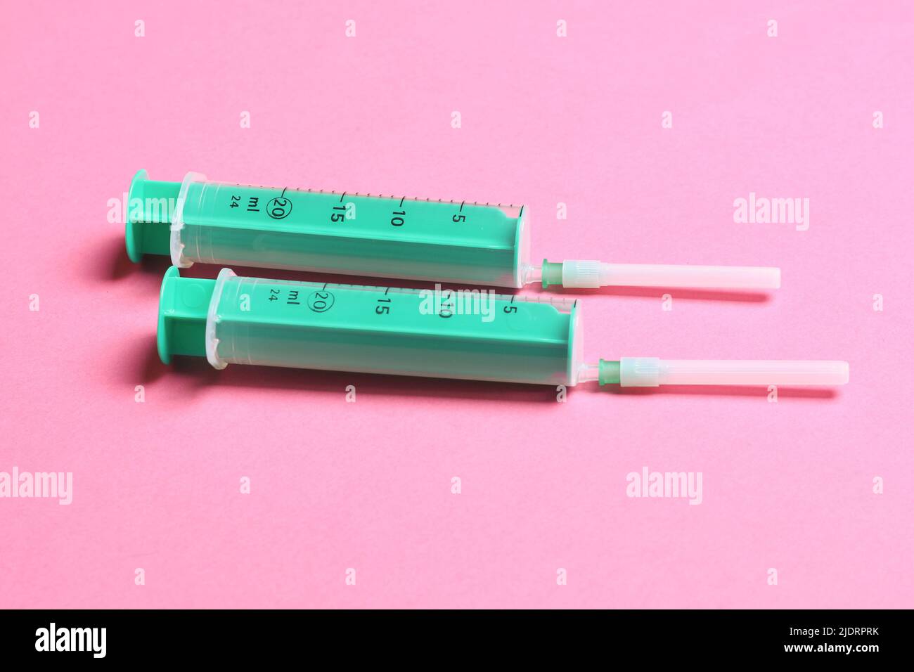 Top view of different syringes for injection on colorful background ...