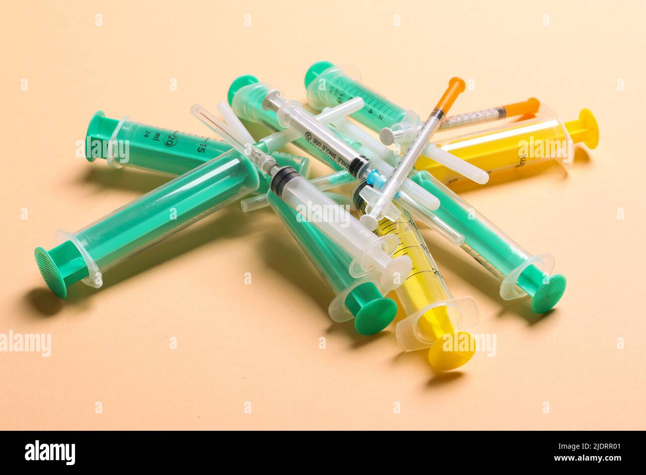 Top view of a pile of medical syringes and insulin syringes with ...
