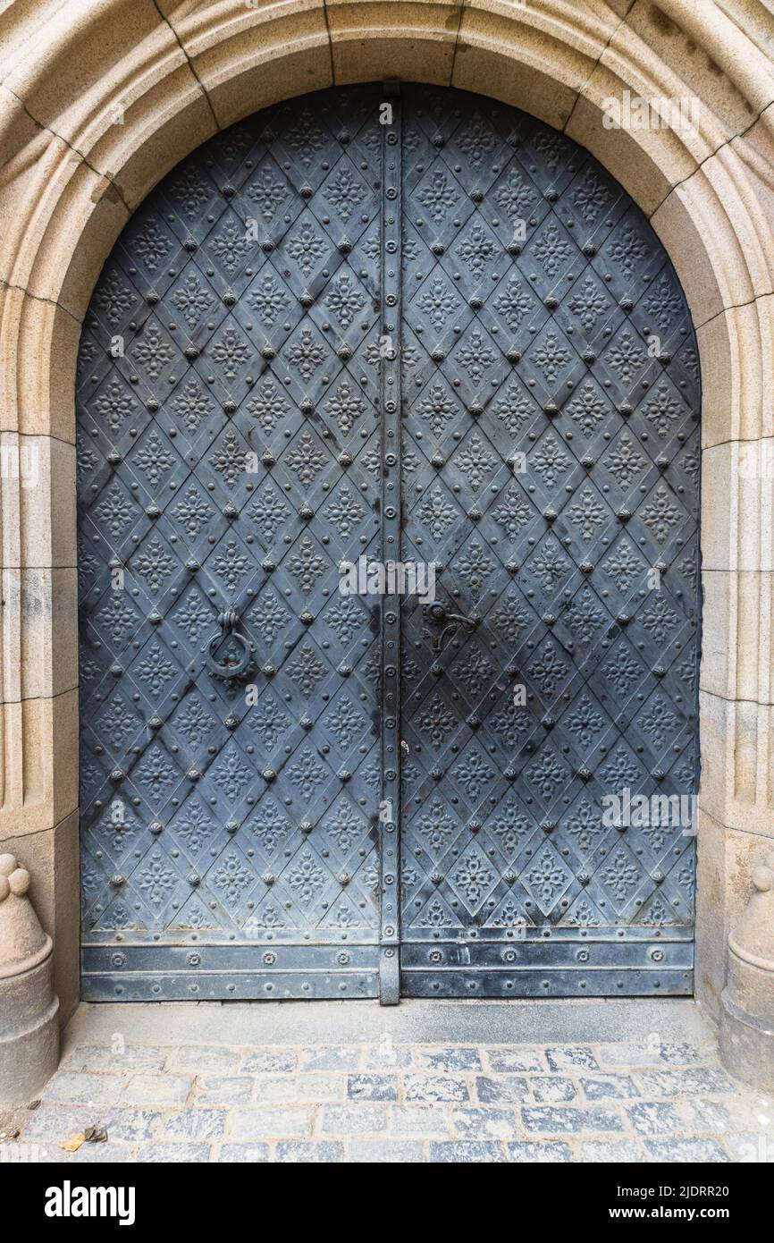 Old iron door to the entrance of the medieval castle Stock Photo - Alamy
