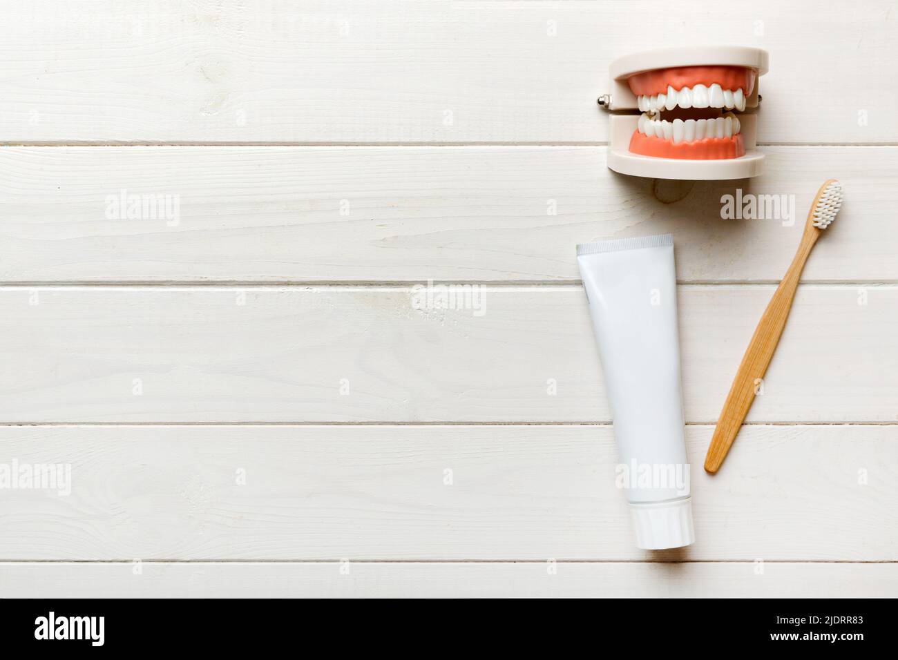 Mouthwash and other oral hygiene products on colored table top view ...