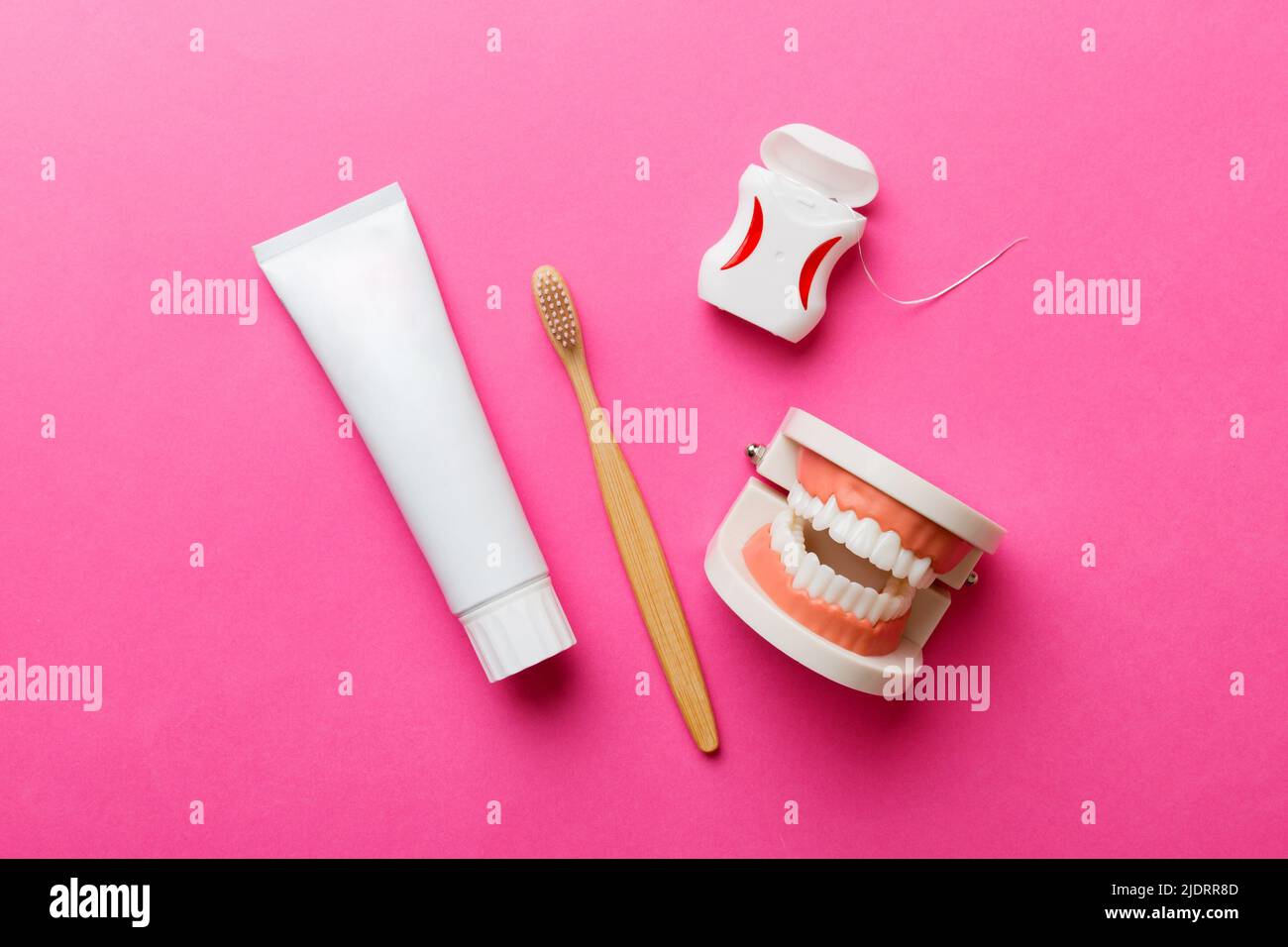 Mouthwash and other oral hygiene products on colored table top view ...