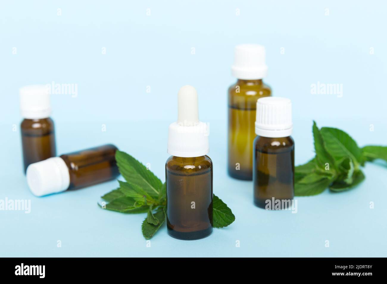 Natural Mint Essential Oil in a Glass Bottle. organic cosmetics with ...