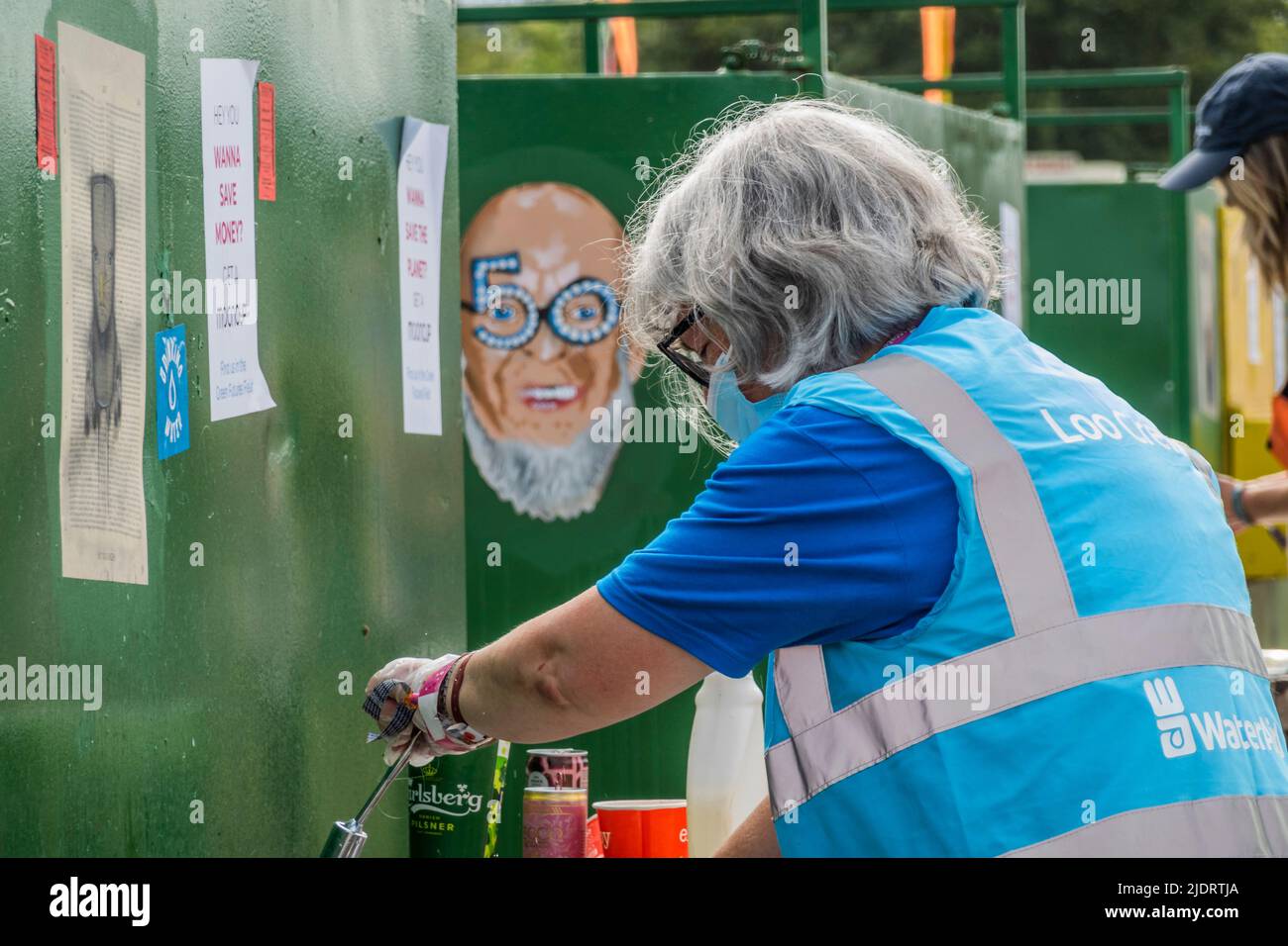 Glastonbury, UK. 23rd June, 2022. Water Aid volunteers keep the toilet ...