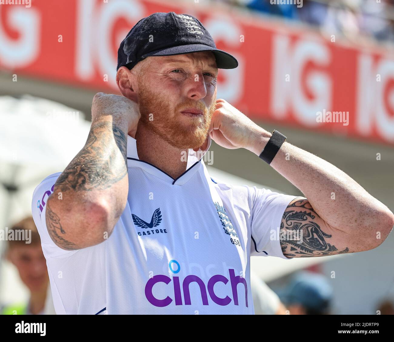 Ben Stokes of England tuns up his collar as he leads England out Stock ...