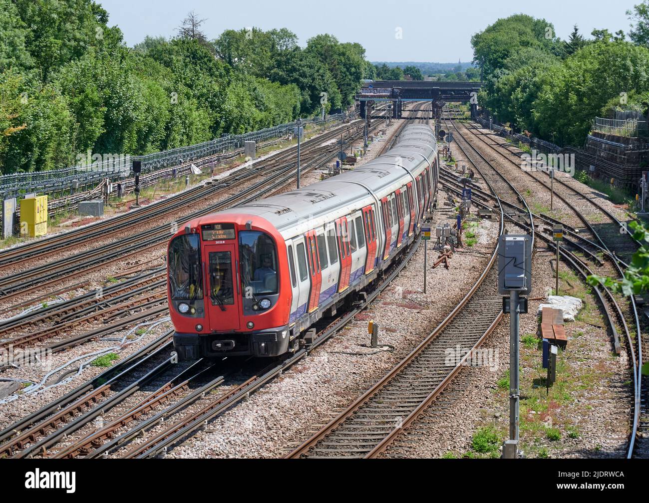 A train of S8 rolling stock approaches Harrow-on-the-Hill forming a mid ...