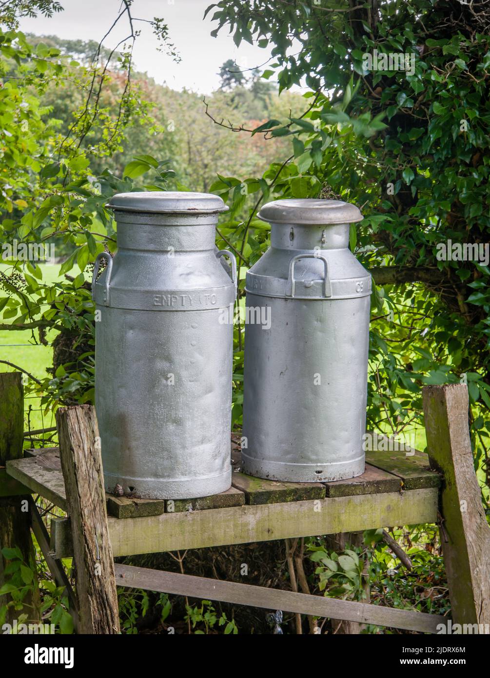 Milk Churns on a roadside milk churn stand, Hutton-Le-Hole, Yorkshire ...
