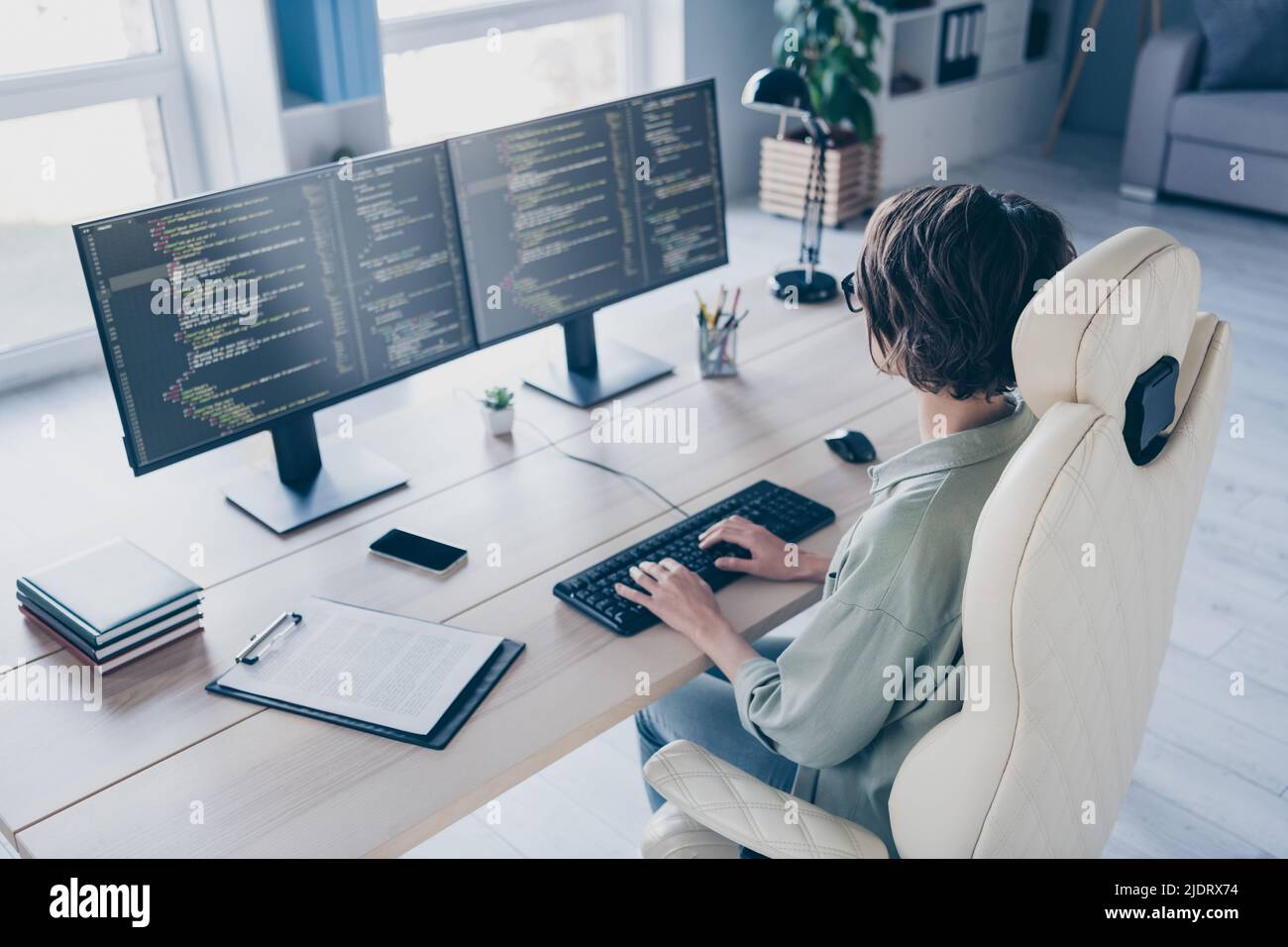 Back view photo of cool representative web-designer girl working hard ...