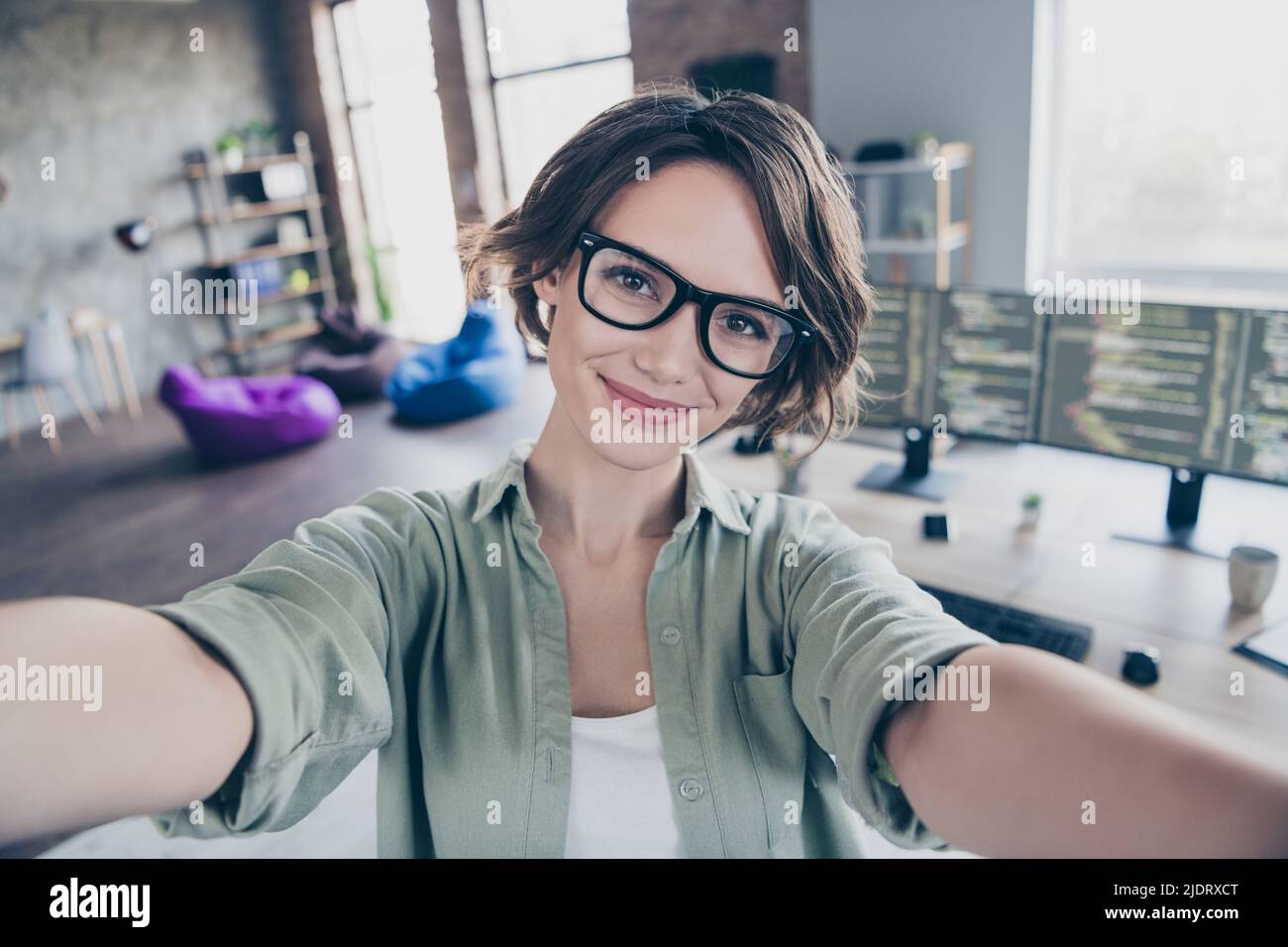 Portrait of charming satisfied pc expert make selfie have good mood ...