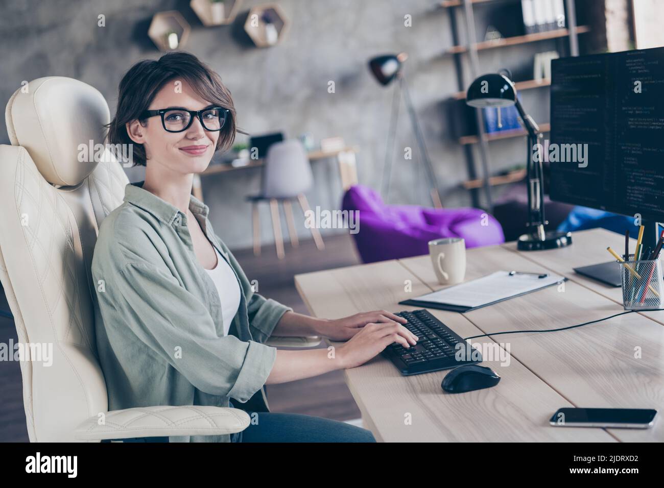 Profile photo of happy clever hardware expert sitting chair keyboard ...
