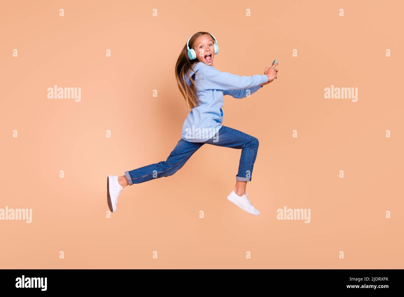 Full length profile portrait of carefree excited girl jump rush fast ...