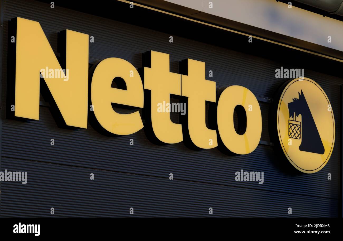 Poznan, Poland. 22 June 2022: Netto sign on a wall. Netto is a Danish ...