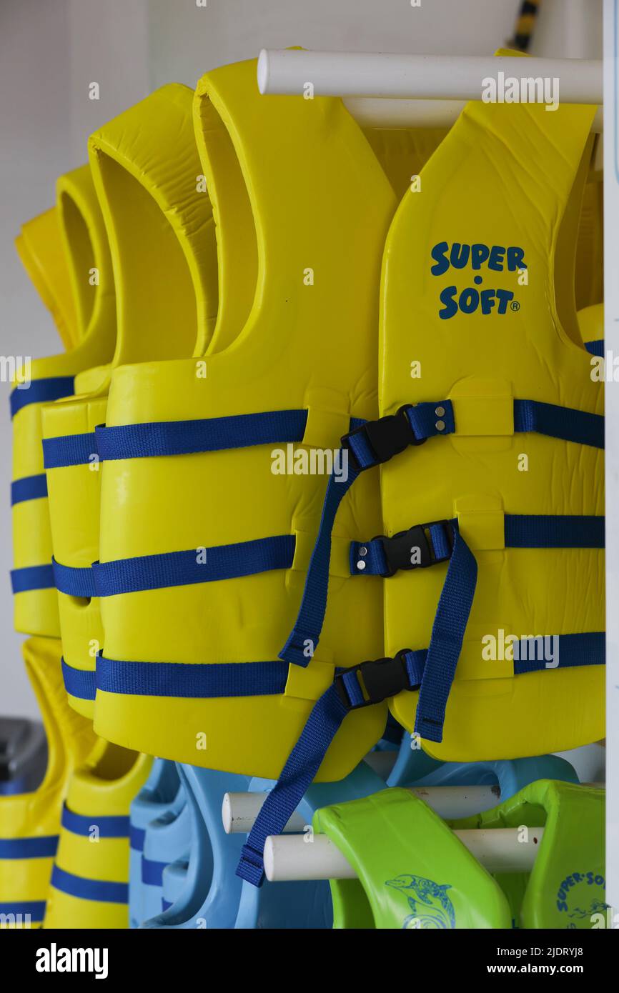 yellow safety lifejacket for the kids by swimming pool on cruise ship ...