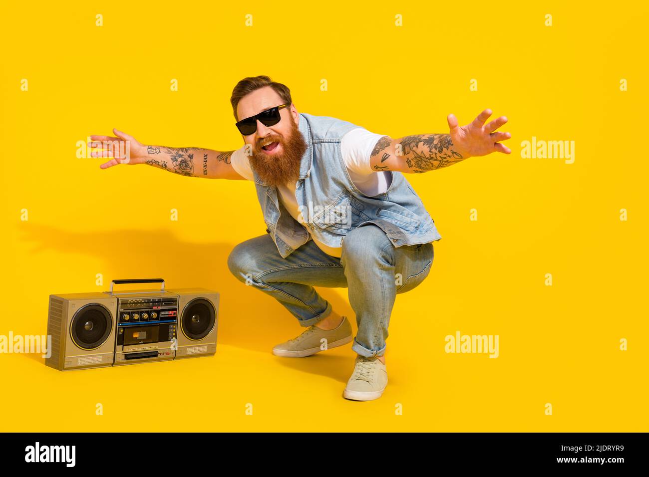 Photo of funny cool guy dressed denim vest dark glasses enjoying songs ...