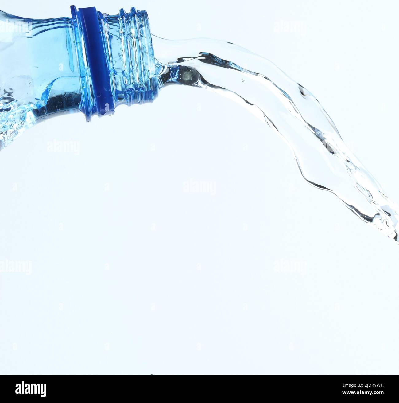 Spilling water from the bottle. Water is good for heath Stock Photo - Alamy