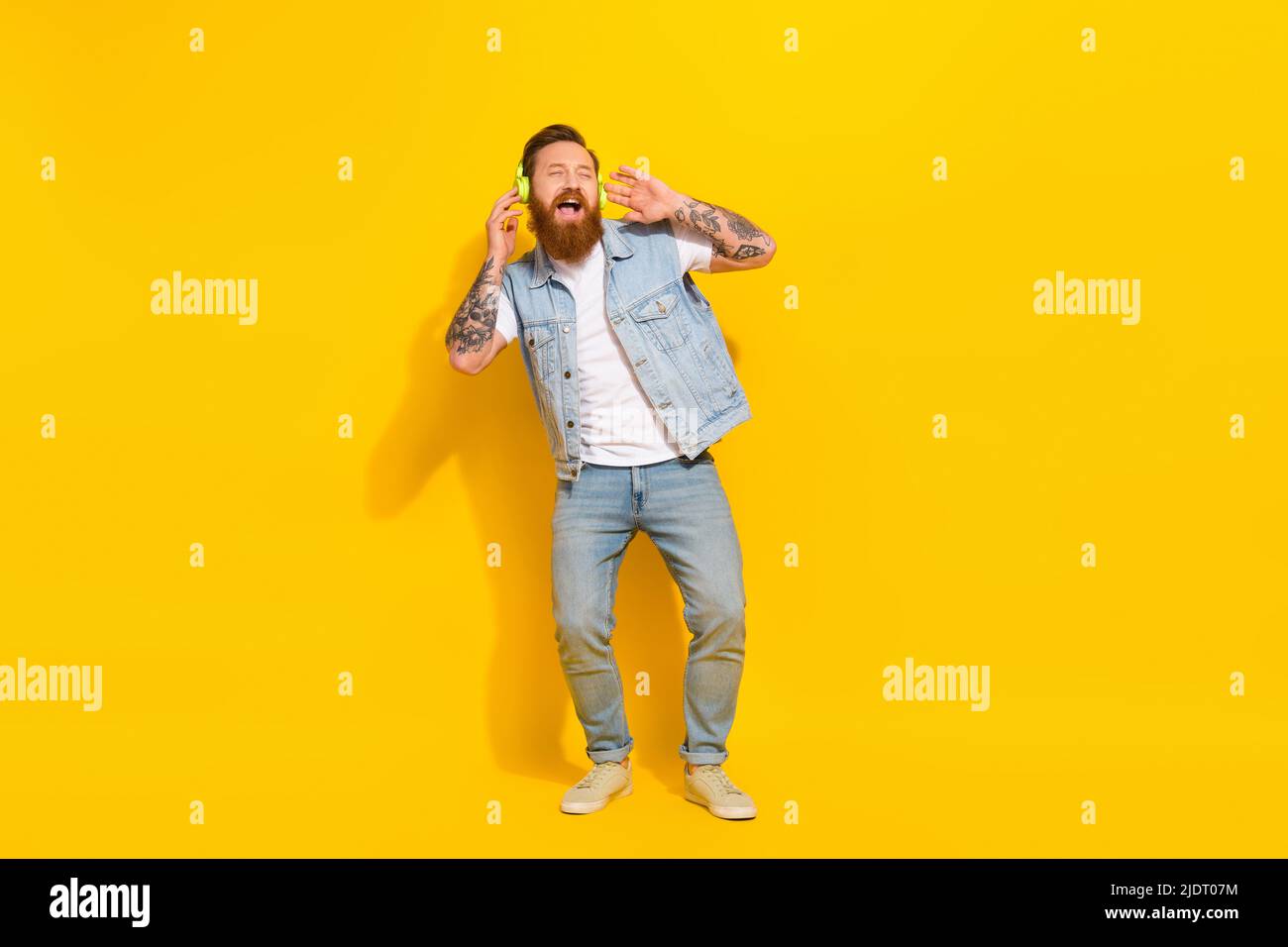 Full body photo of excited cheerful man closed eyes dancing listen new ...