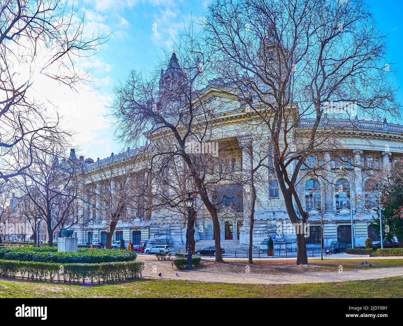 The trees hide the scenic stone building of Exchange Palace with carved ...