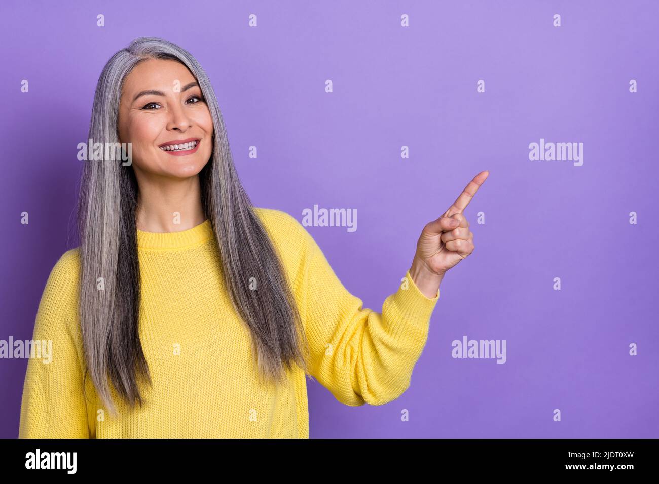 Photo of mature cheerful female promote you good quality product point ...