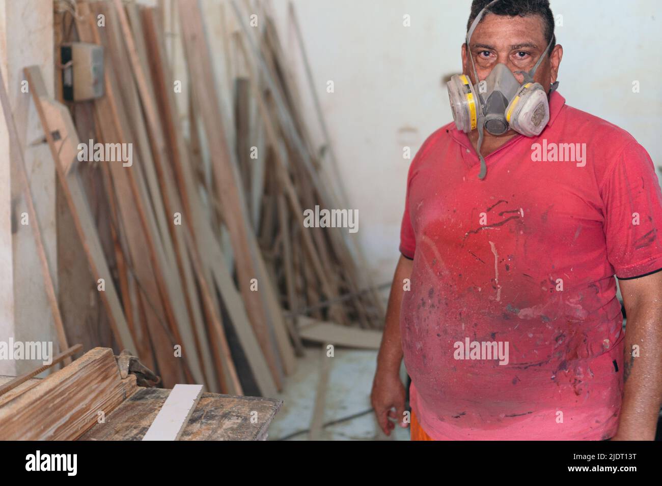 Latin carpenter in wood workshop Stock Photo - Alamy