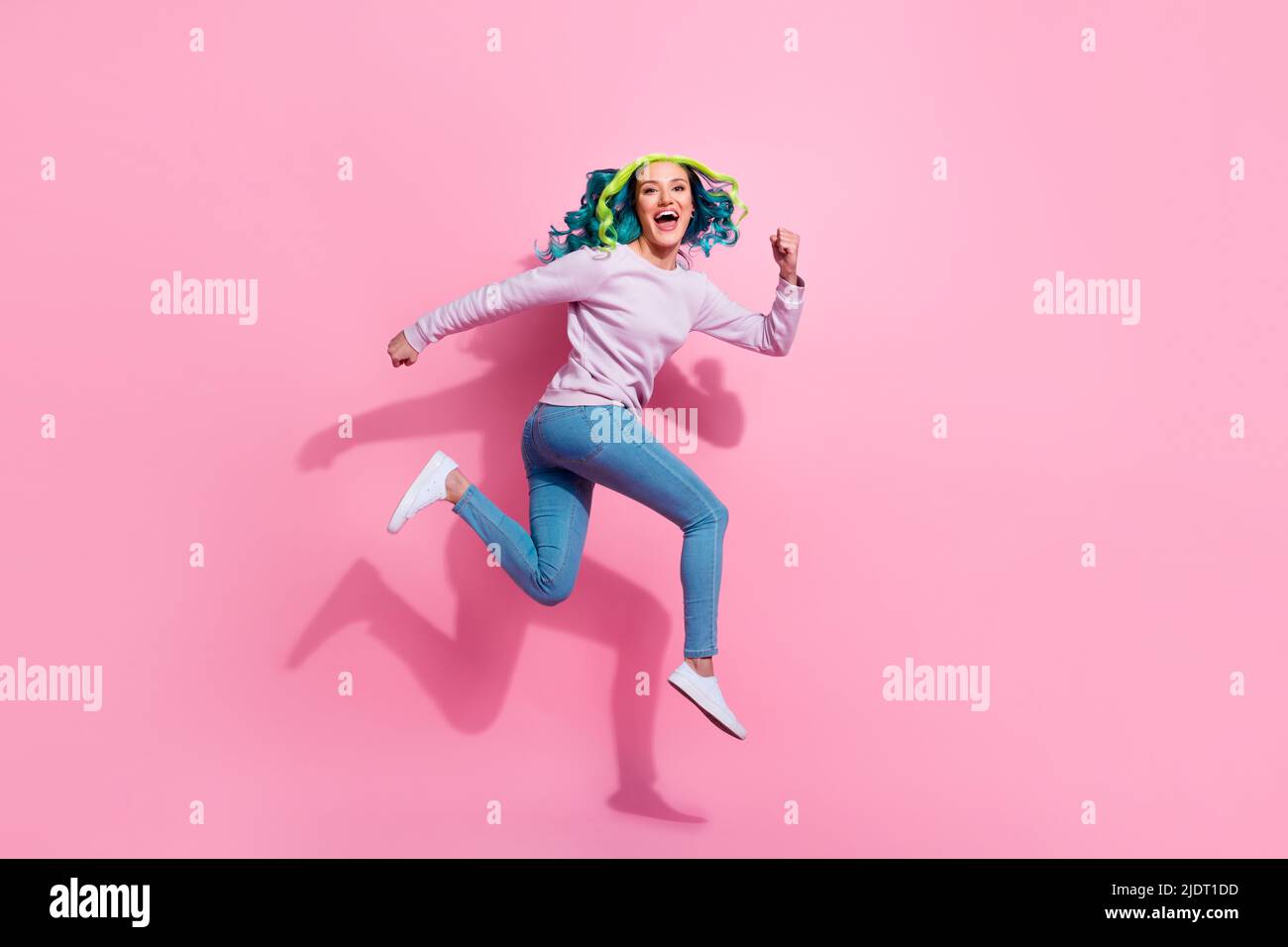 Full body photo of sporty overjoyed lady jump running rush fast have ...