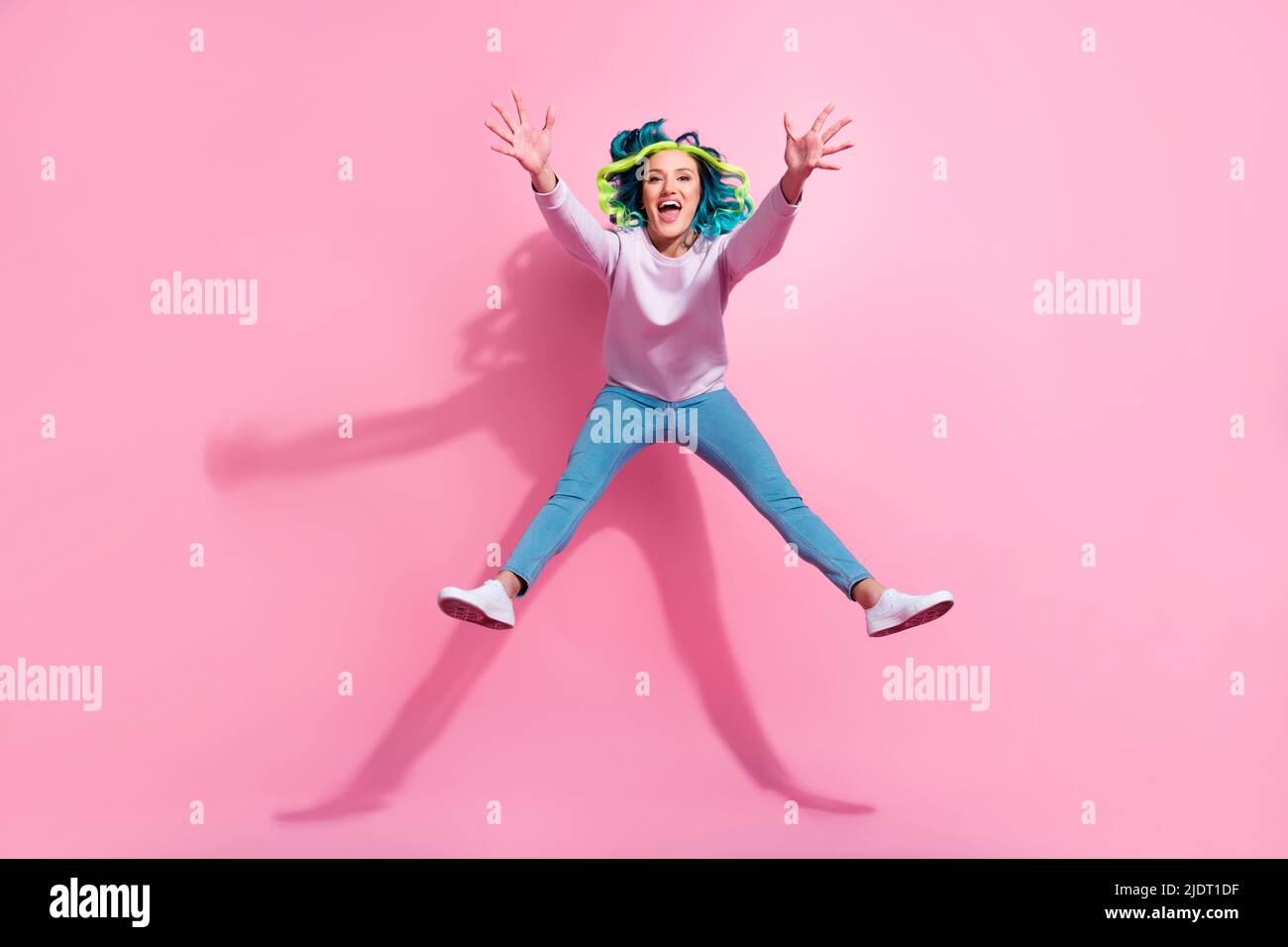 Full length photo of active satisfied person falling jumping raise ...