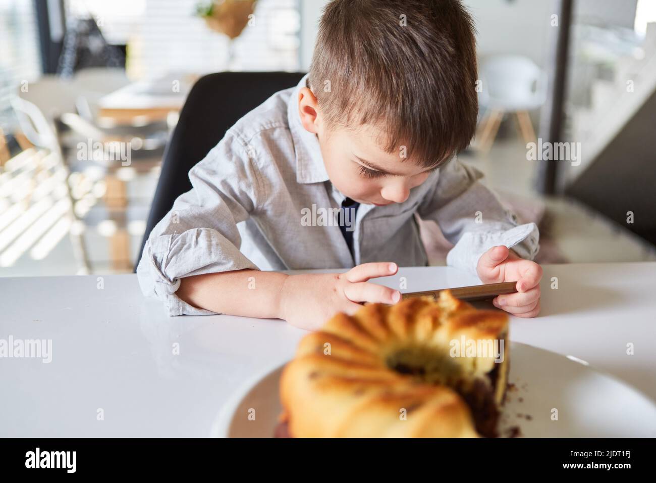 Boy reads a text message on his smartphone or on social media with ...