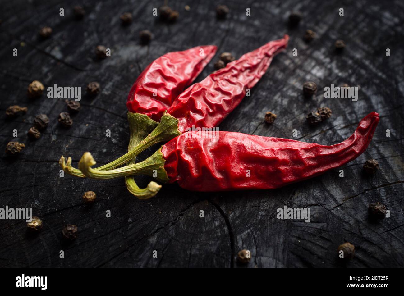 hot red pepper and black pepper Stock Photo - Alamy