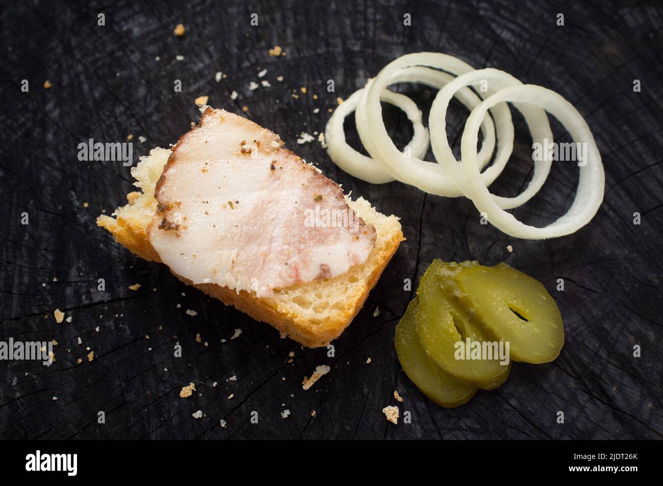 sandwich with becon, onions and pickled cucumber Stock Photo - Alamy