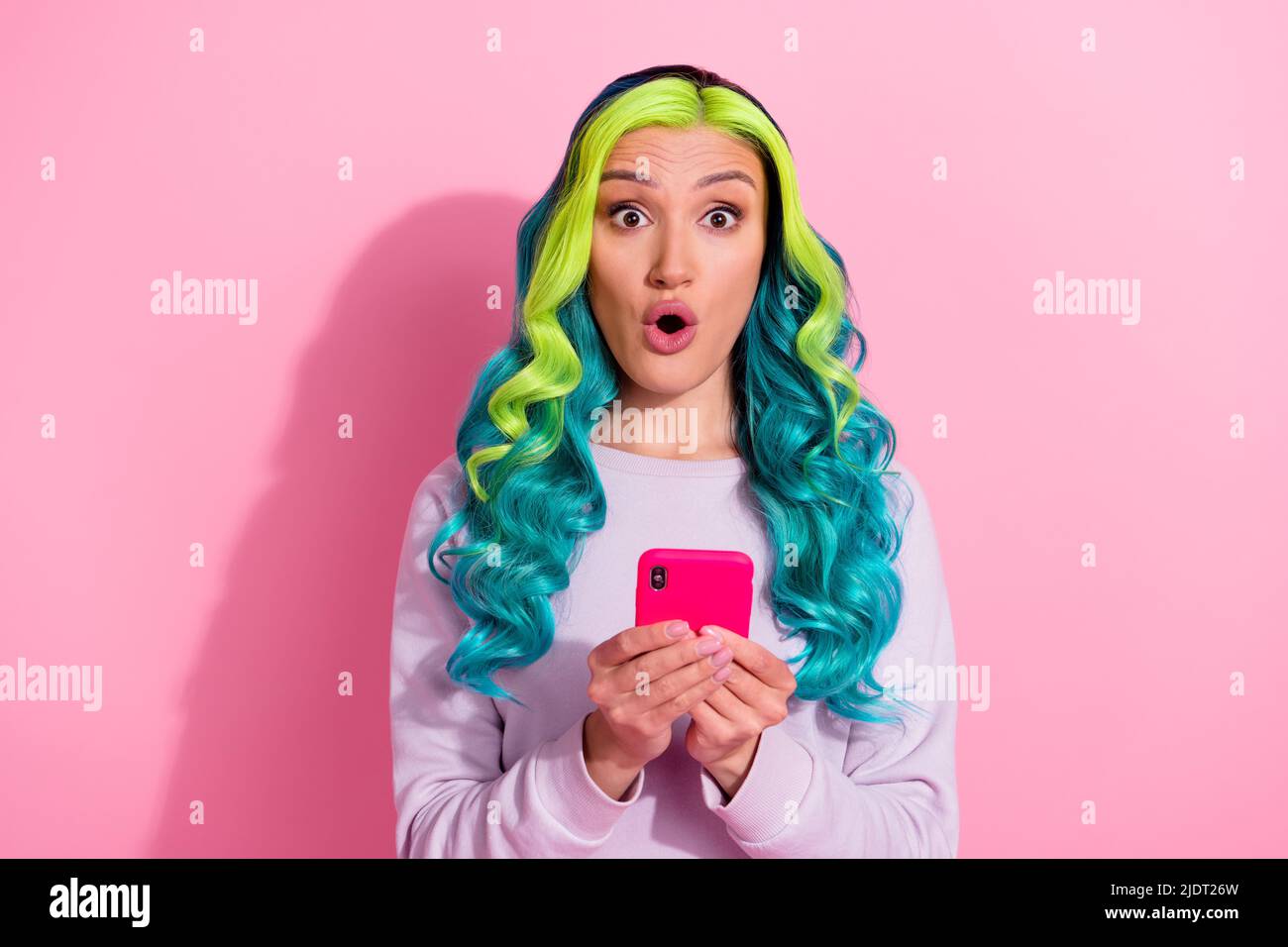 Photo of impressed young lady hold telephone open mouth stare ...
