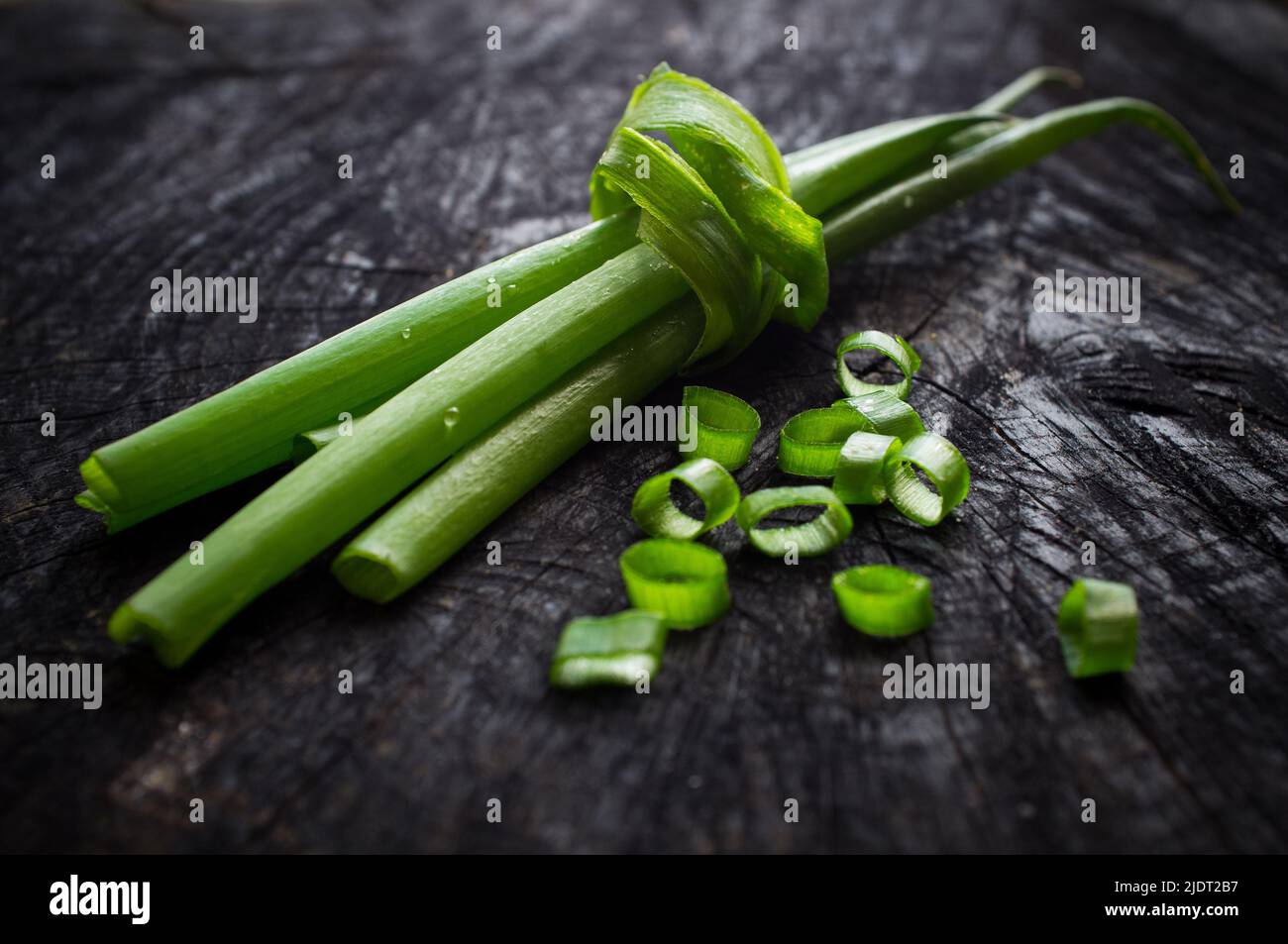 Bunch green onions on black hi-res stock photography and images - Alamy