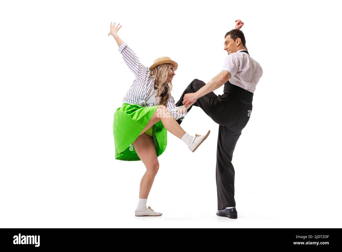 Excited young man and woman dancing, jumping, having fun isolated on ...