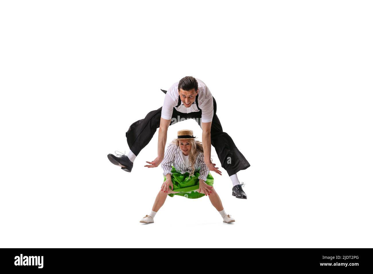 Excited young man and woman dancing, jumping, having fun isolated on ...