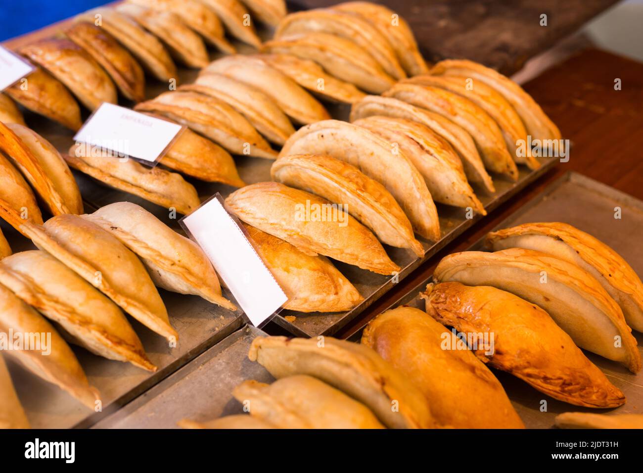freshly baked empanadas with different fillings for sale Stock Photo ...