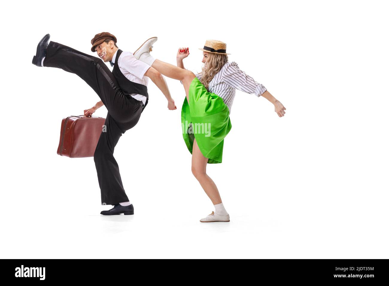 Excited young man and woman dancing, jumping, having fun isolated on ...