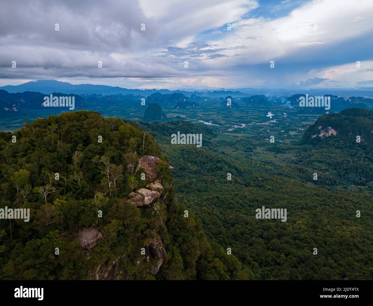 Dragon Crest mountain Krabi Thailand, a Young traveler sits on a rock ...