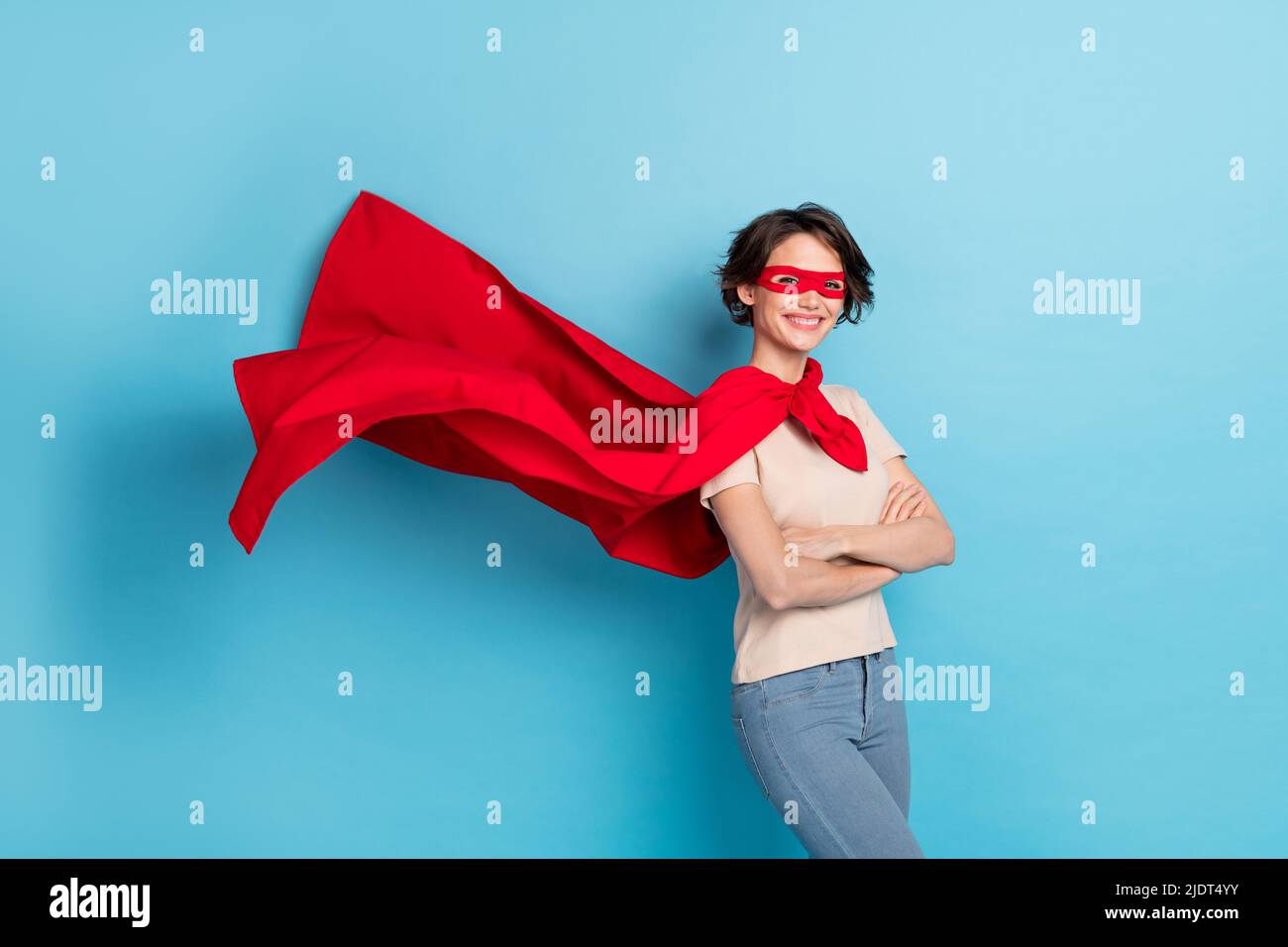 Photo of confident shiny lady dressed red mantle arms crossed cape ...