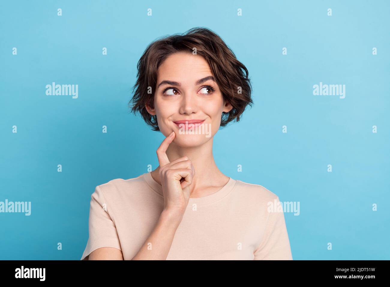 Portrait of young interested woman fantasizing look empty space ...