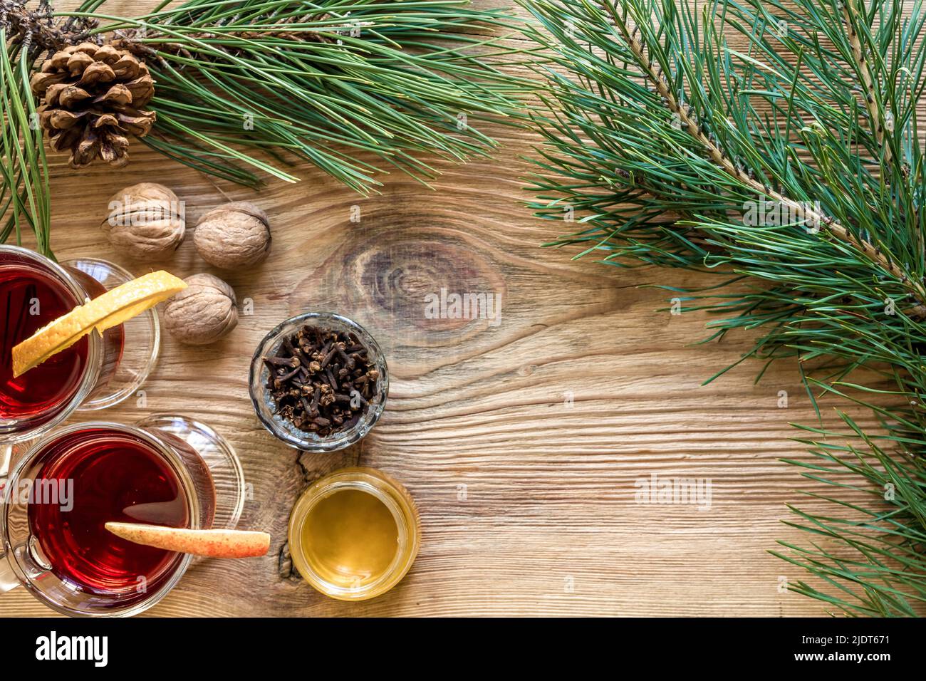 Two glass of mulled wine with cinnamon sticks, slice of oranges and ...