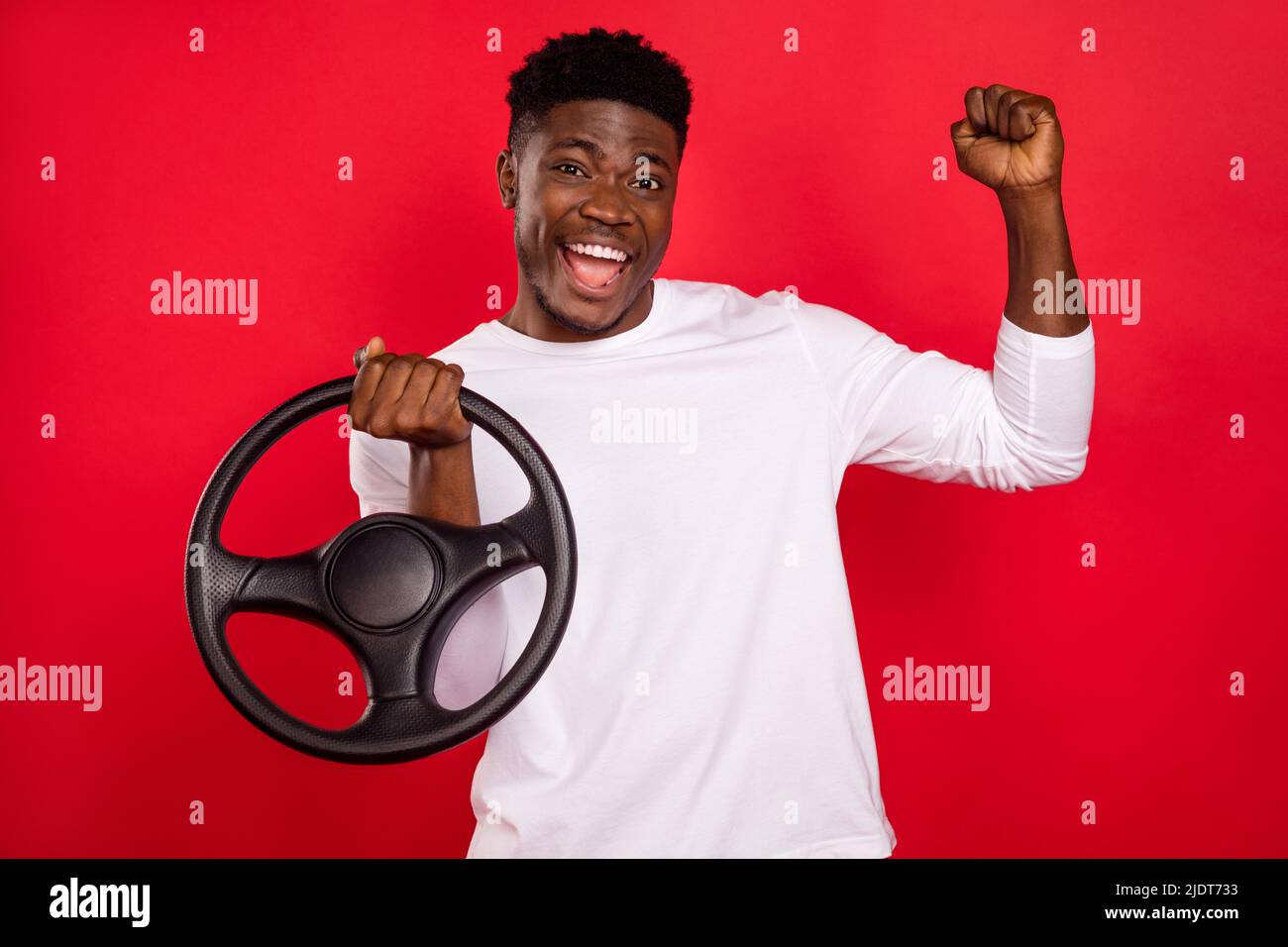 Photo of lucky funky guy dressed white shirt rising fist holding ...