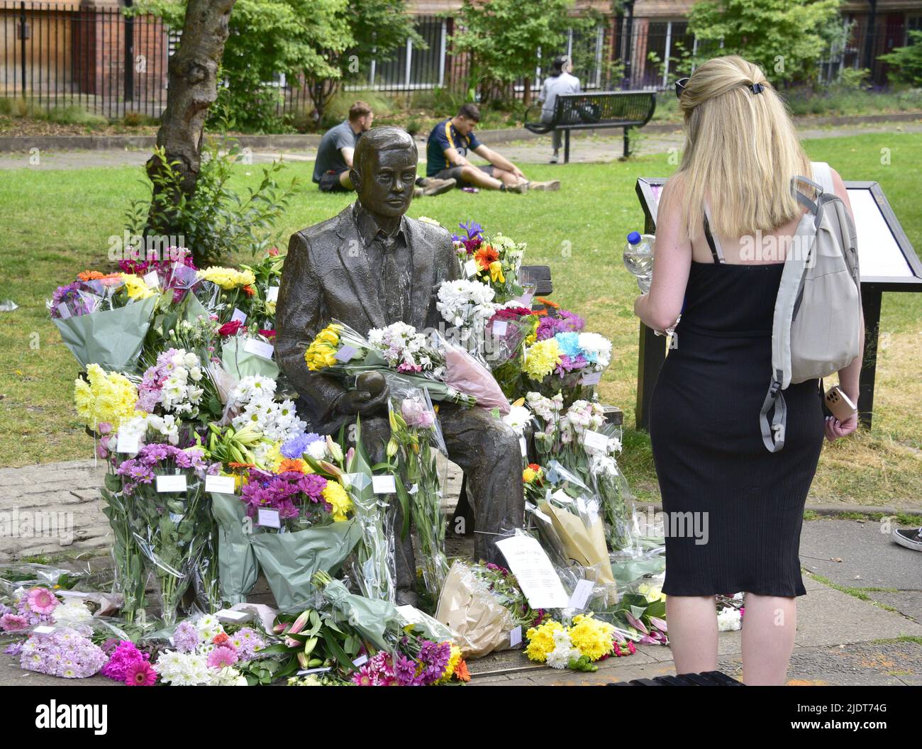 Manchester, UK. 23rd June, 2022. Bunches of flowers left at the Alan ...