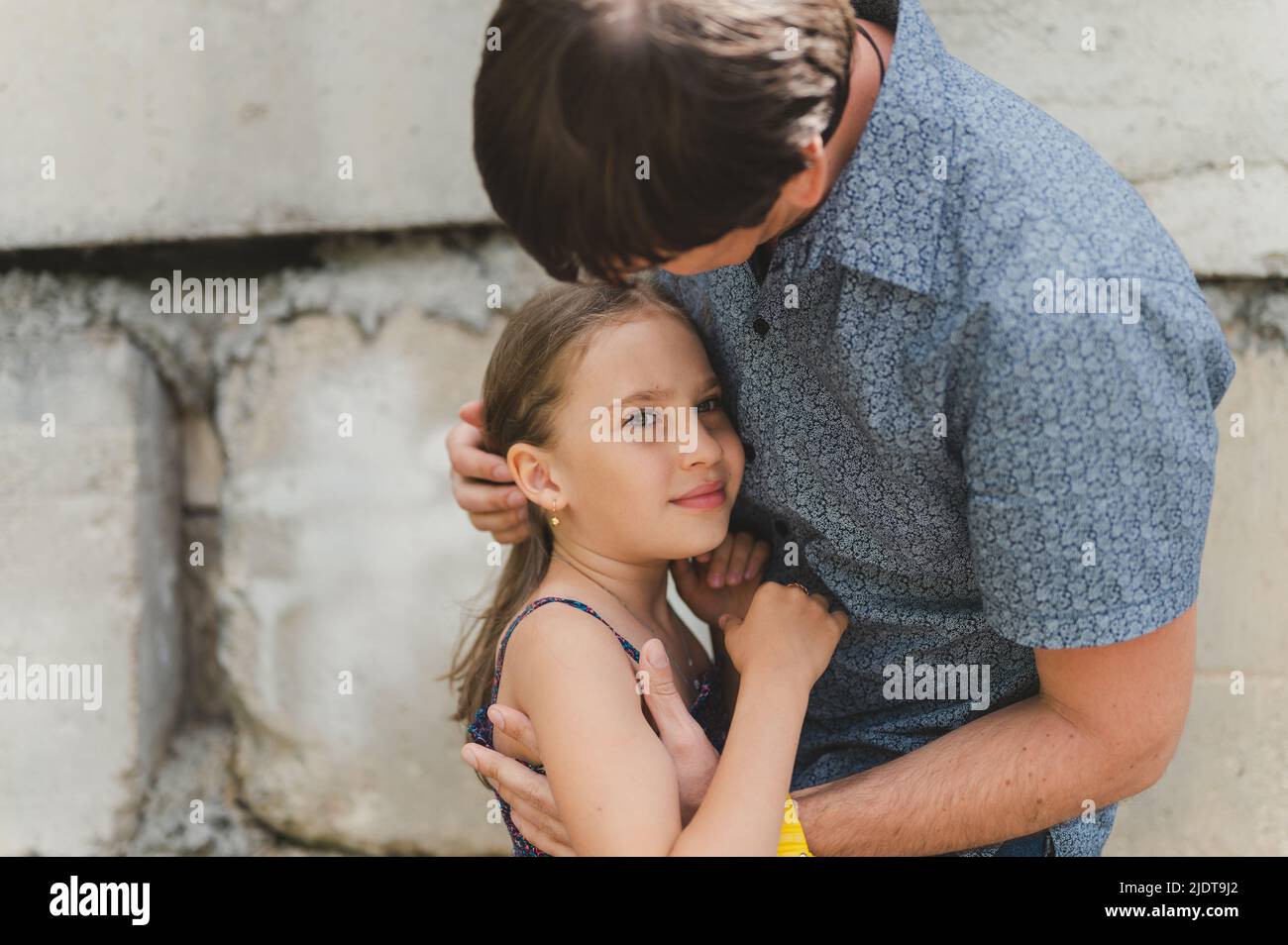 man dad having time with kid daughter girl nine year hugs and ...