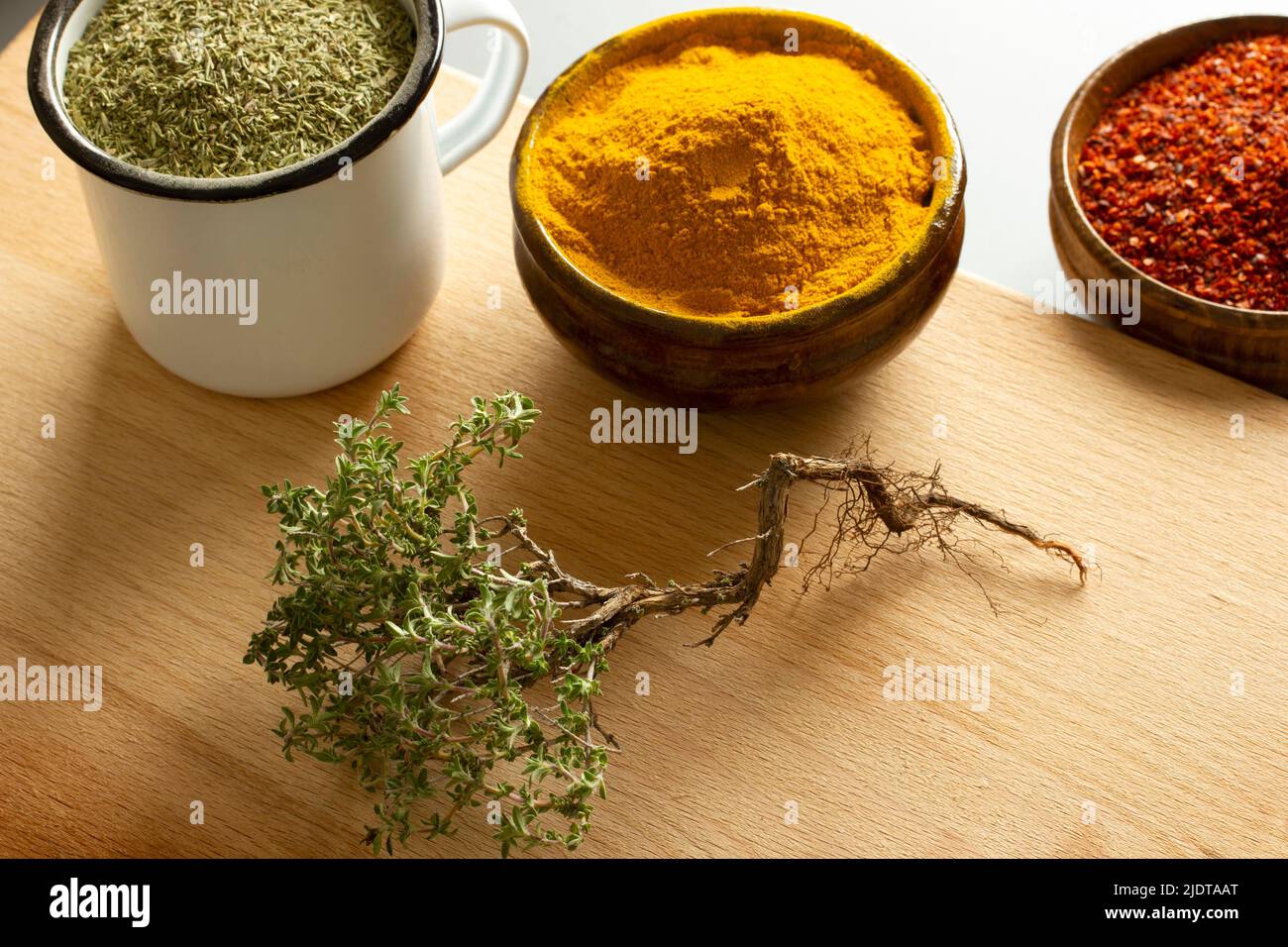 Types of spices. Thyme. Turmeric. Red powdered pepper Stock Photo - Alamy