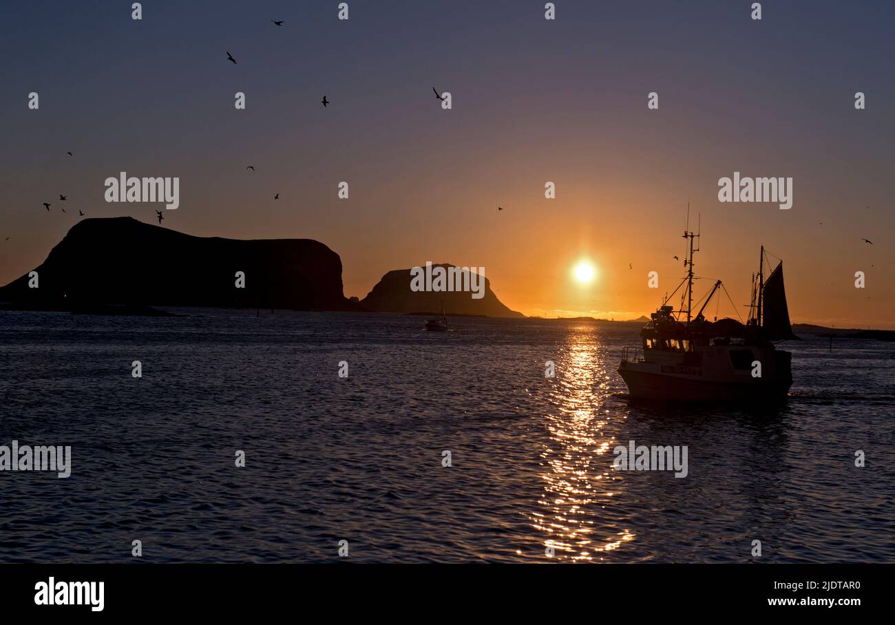 February sunset at Röst, Lofoten. Norway. Vedöya in the background ...