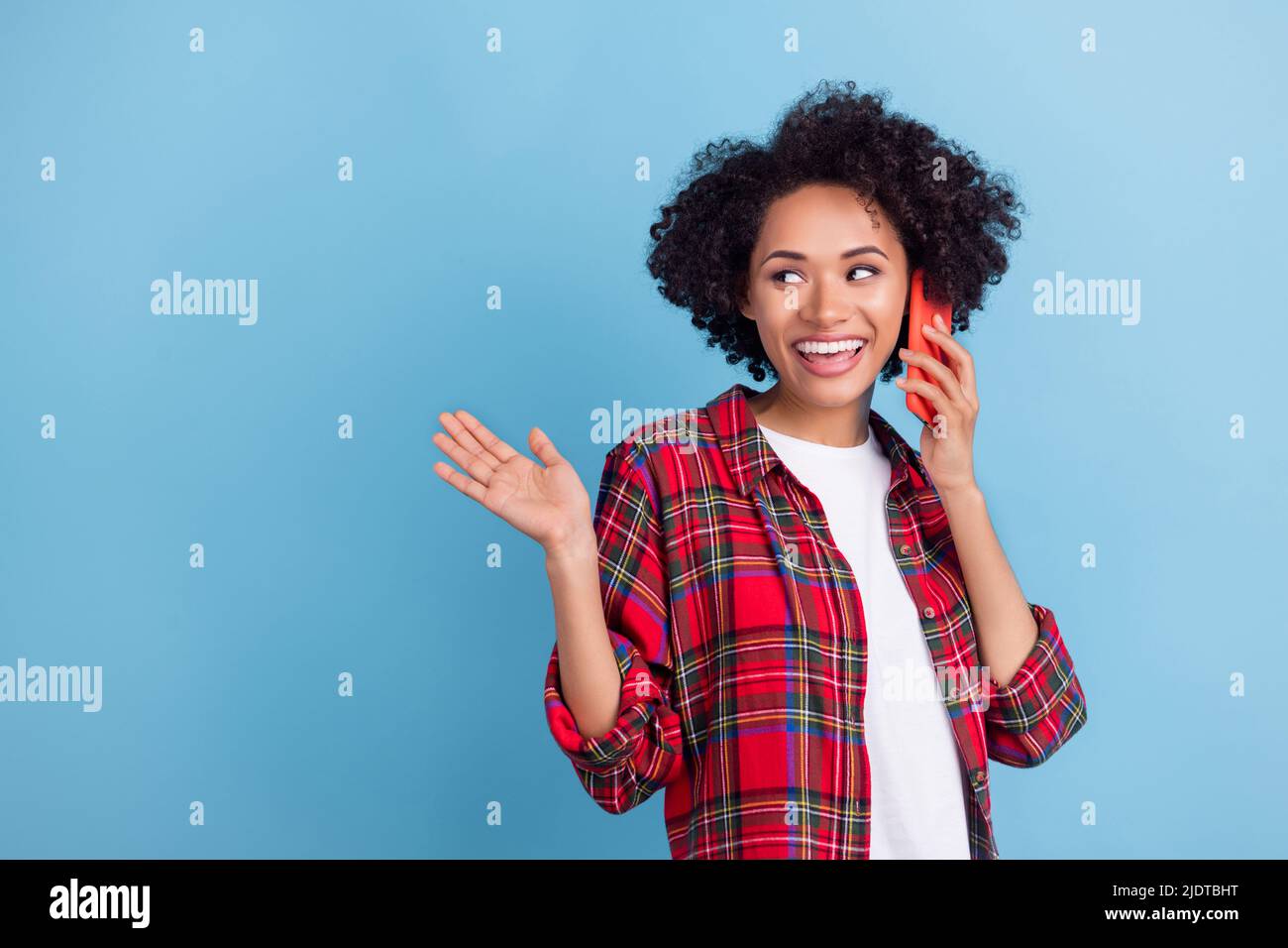 Photo of young african girl happy positive smile speak cellphone talk ...