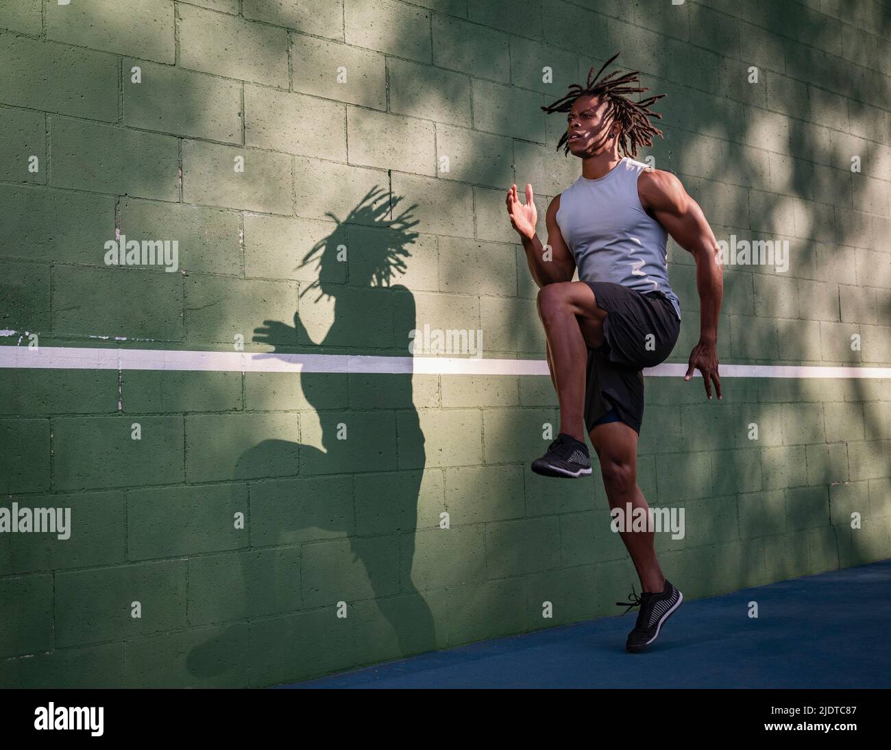 Man running up wall hi-res stock photography and images - Alamy