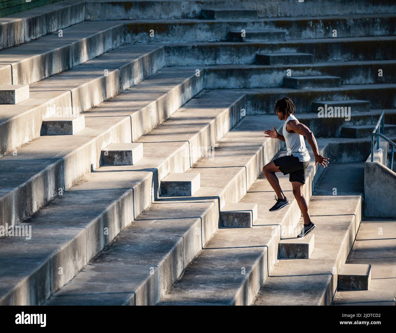 Athletic man running up steps hi-res stock photography and images - Alamy