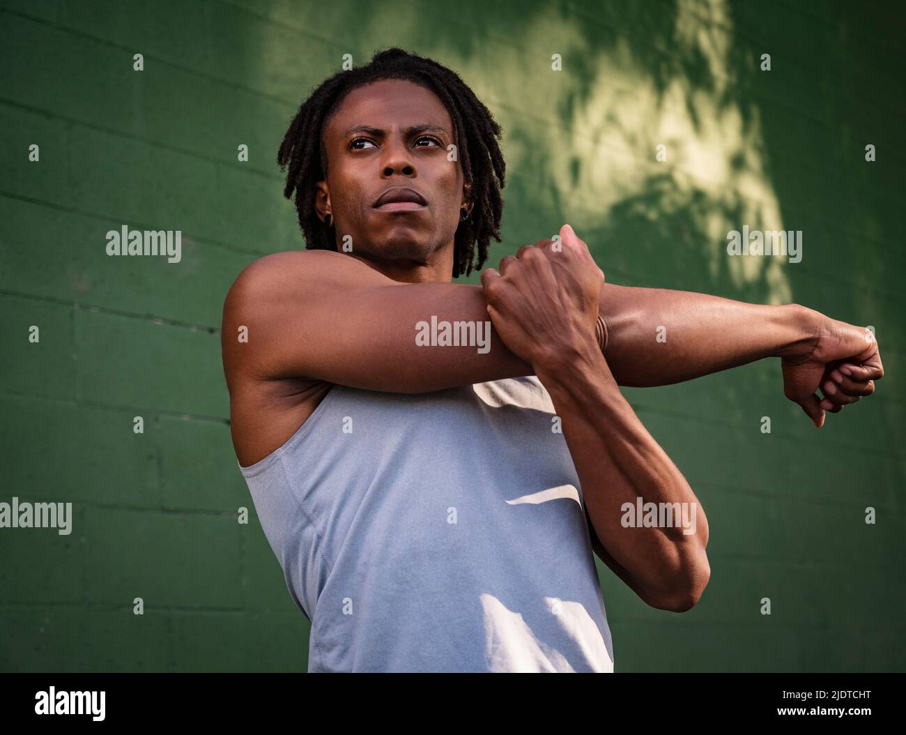 Man stretching arm hi-res stock photography and images - Alamy