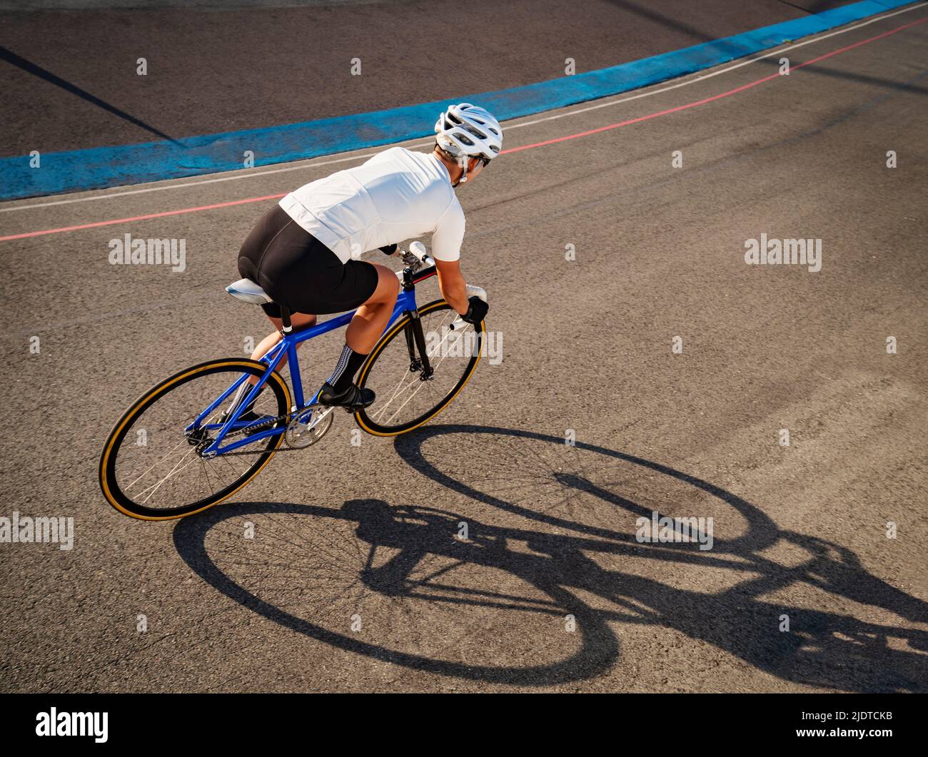 Athletic woman with prosthetic arm riding bicycle Stock Photo - Alamy