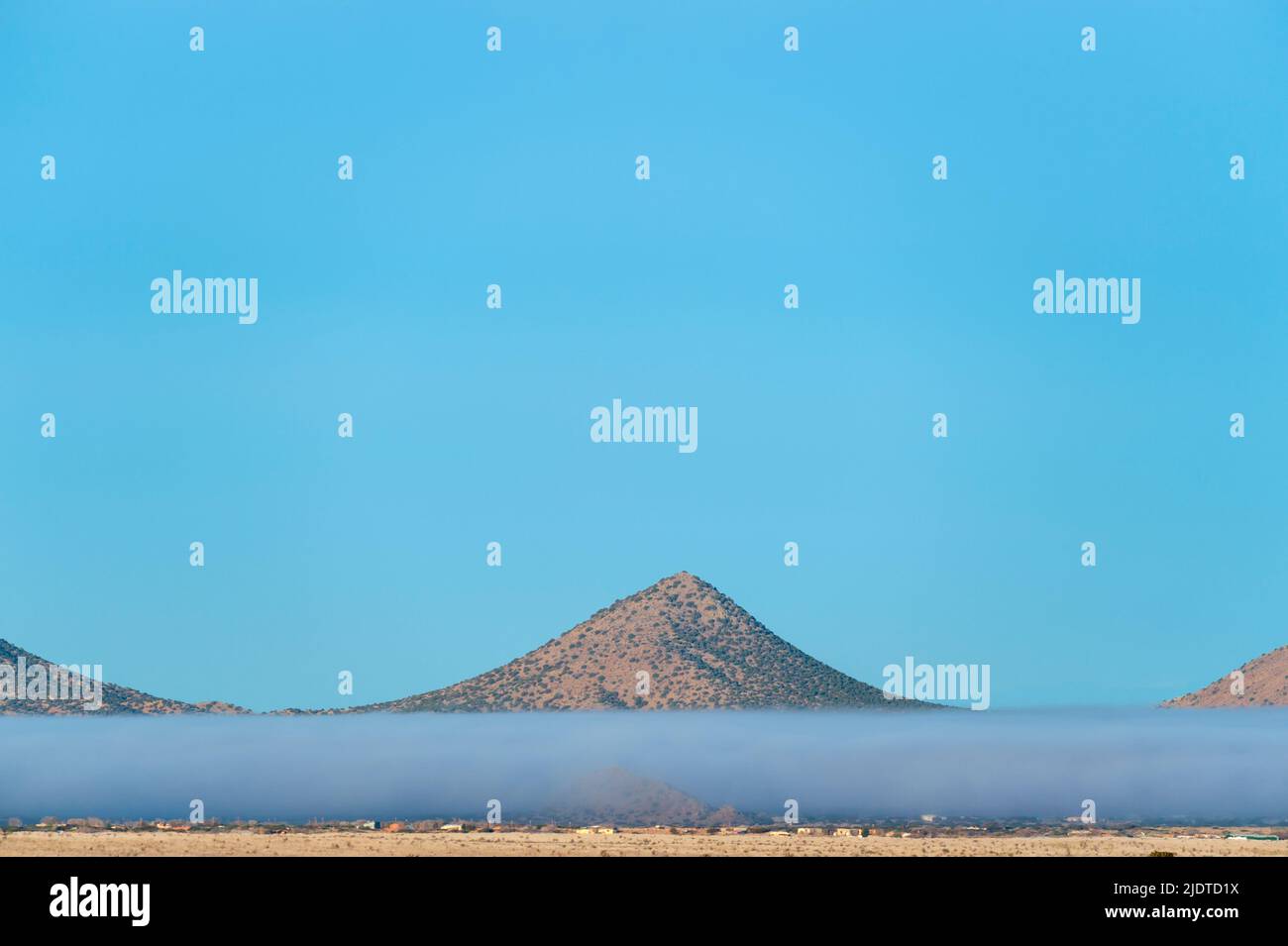 USA, New Mexico, Santa Fe, Fog above desert landscape in Cerrillos ...