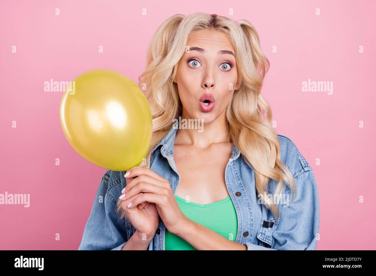 Photo of young girl amazed shocked pouted lips hold air ball decoration ...