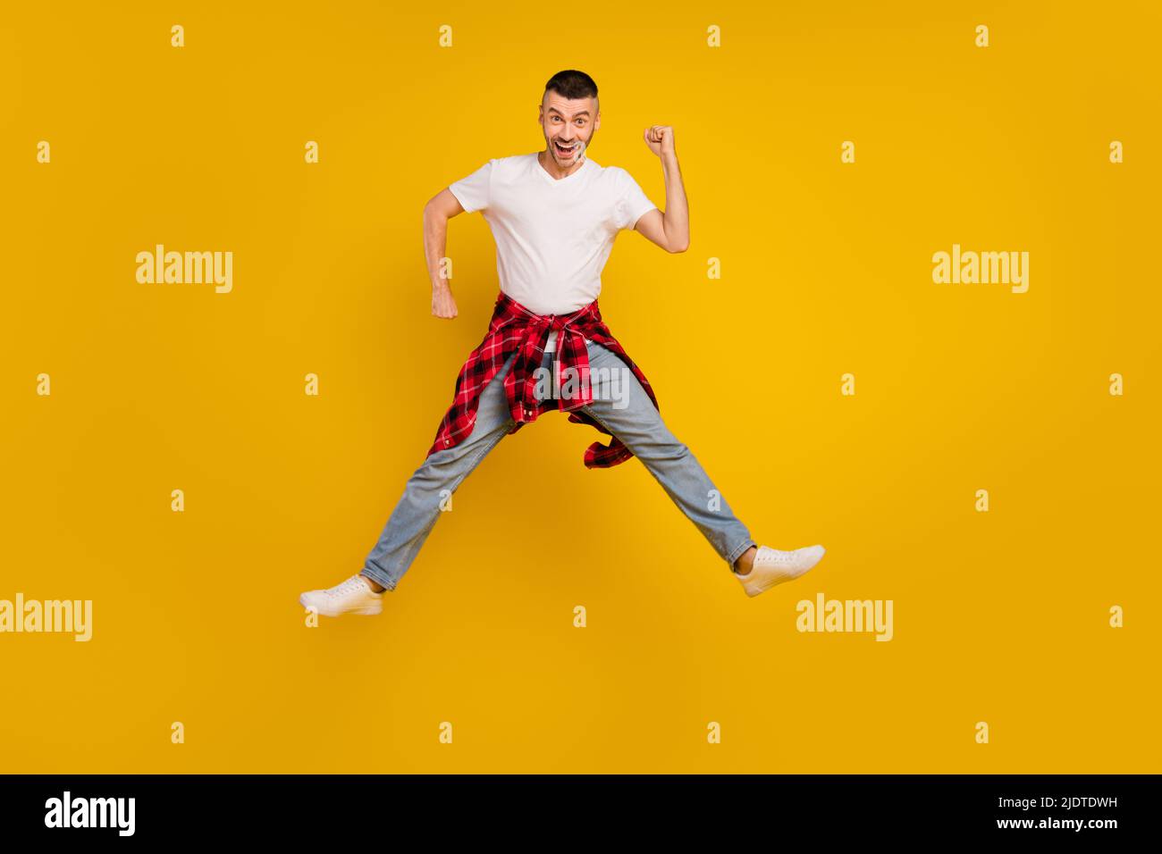 Full length body size photo man jumping fooling playful isolated vivid ...